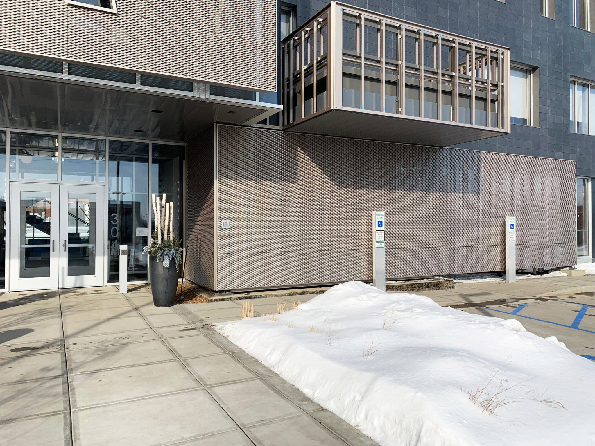 Expanded Mesh Façade, Signage, and Feature Wall